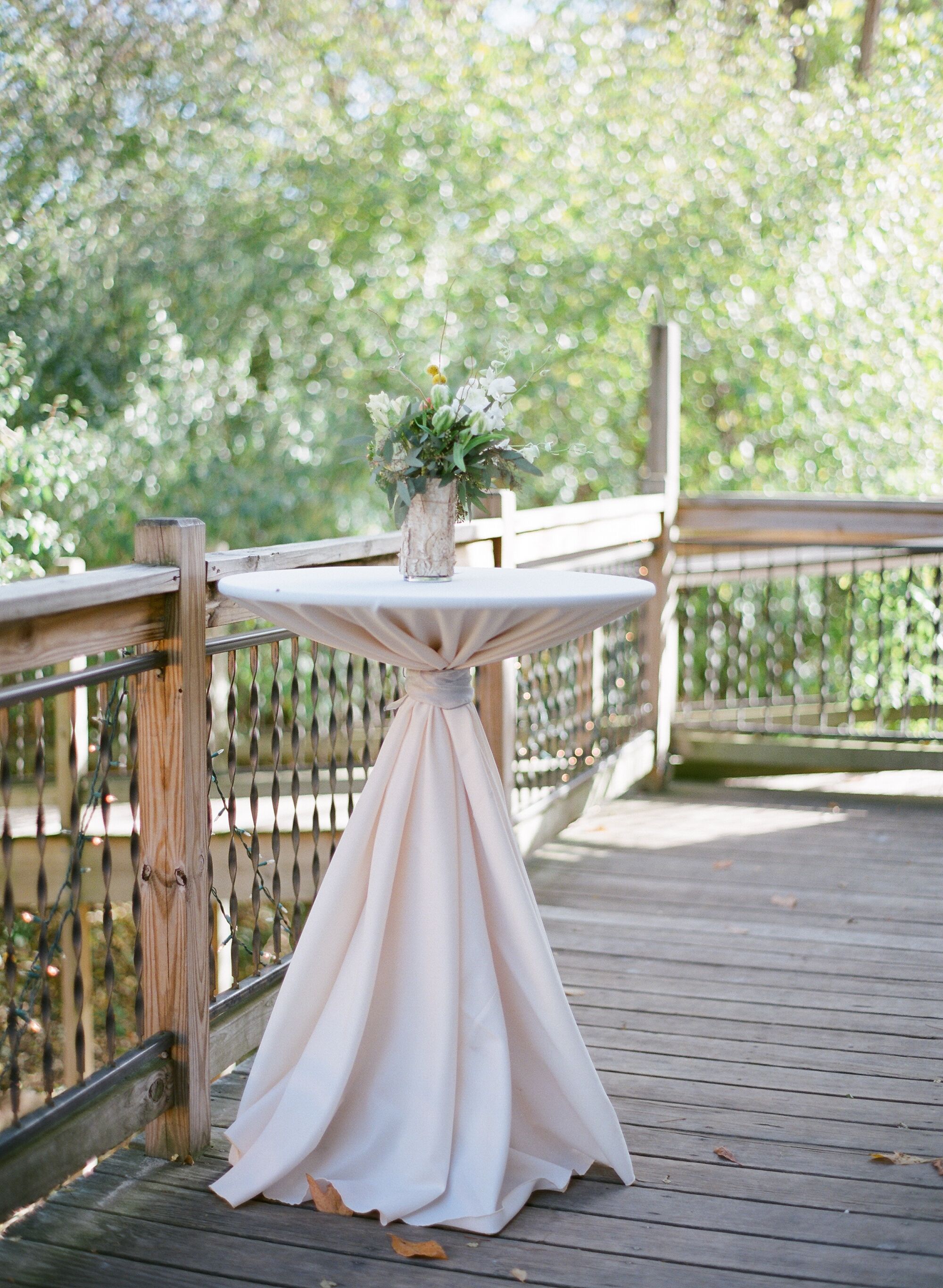 Linen Tablecloths with Green Floral Centerpiece