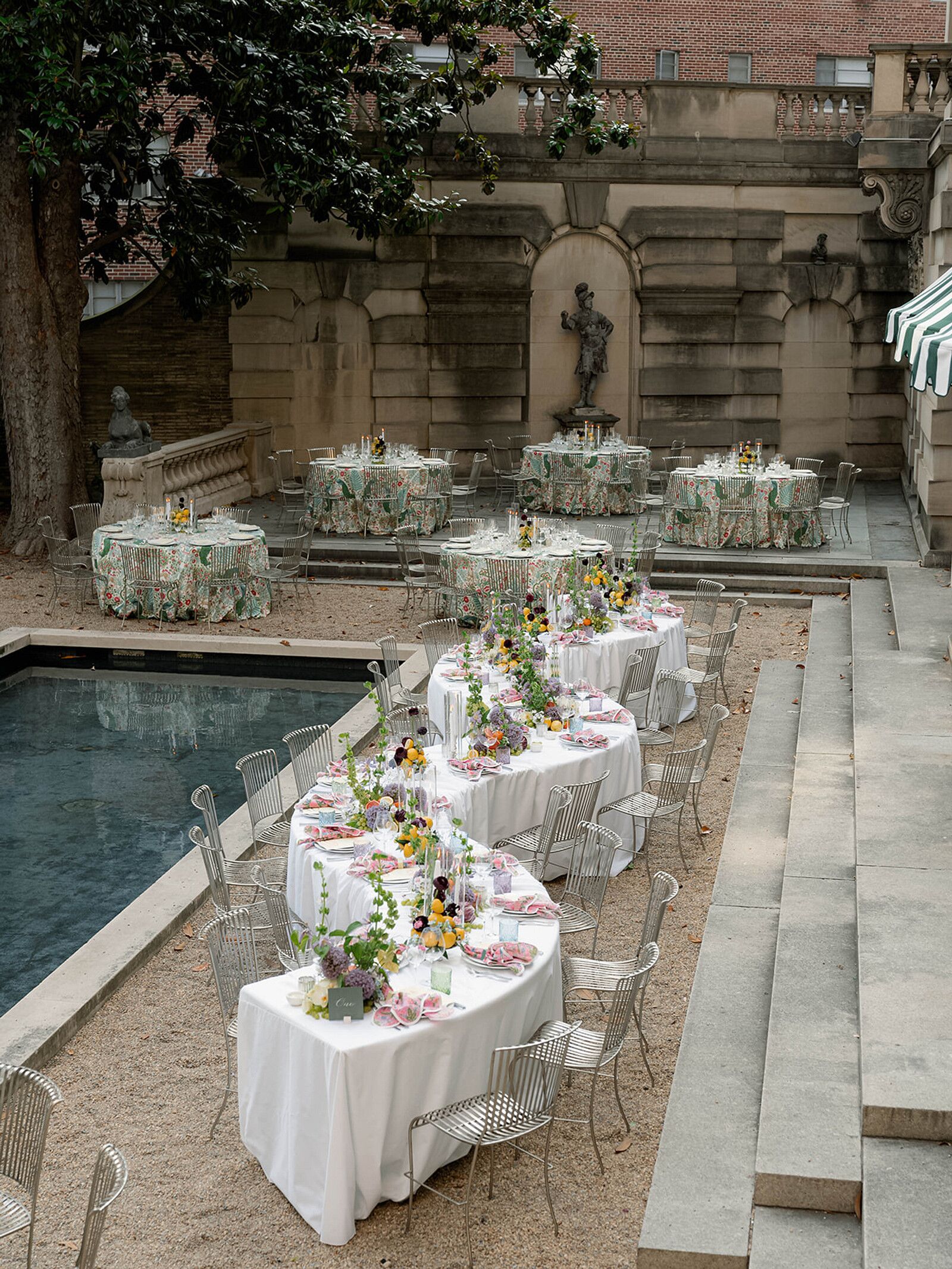 Serpentine and Round Dinner Tables in a Courtyard