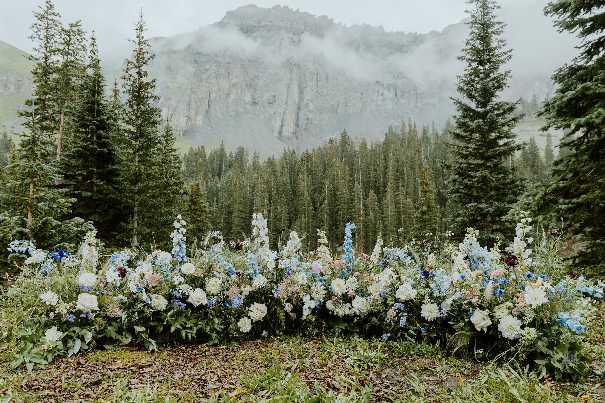 Ceremony Floral Arrangement of Wildflowers on Ground at Outdoor Rustic ...