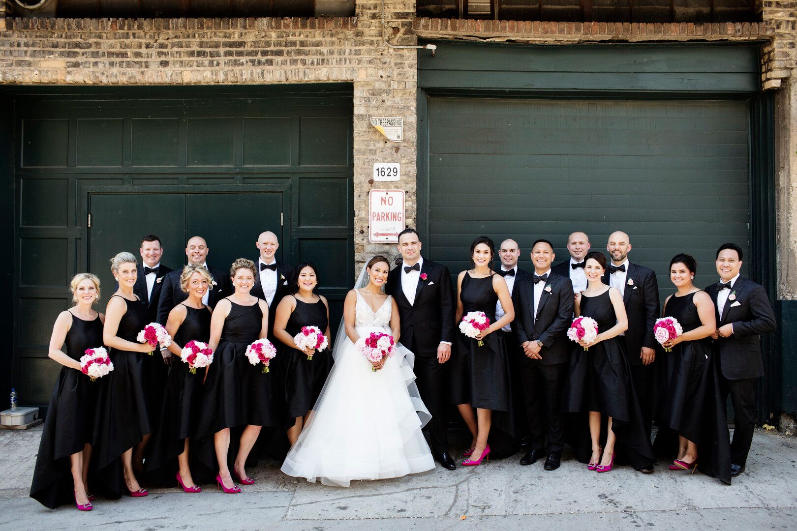 Bride and Groom Pose with Wedding Party