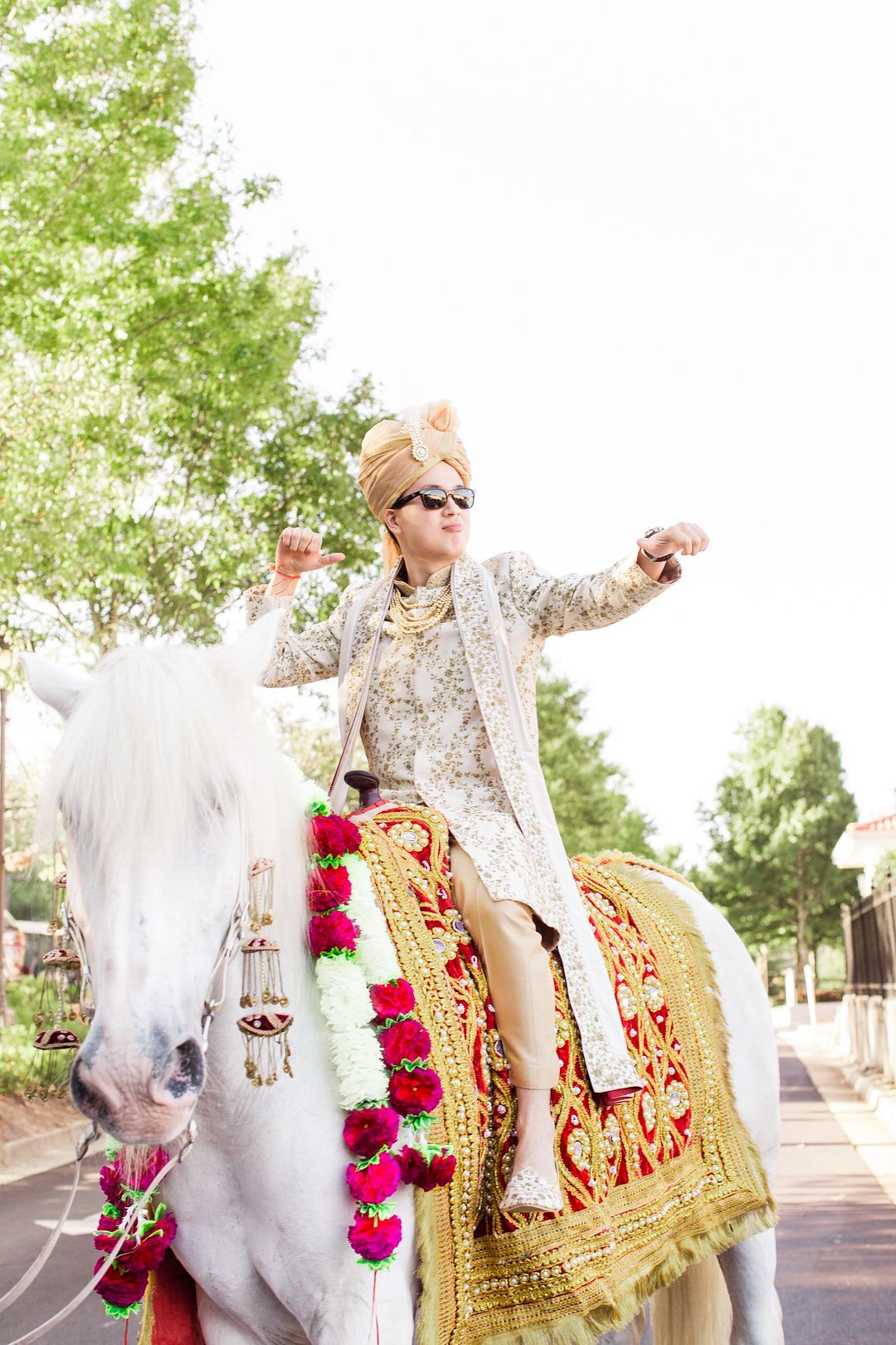 Traditional Hindu Baraat, White Horse and Groom in Sherwani