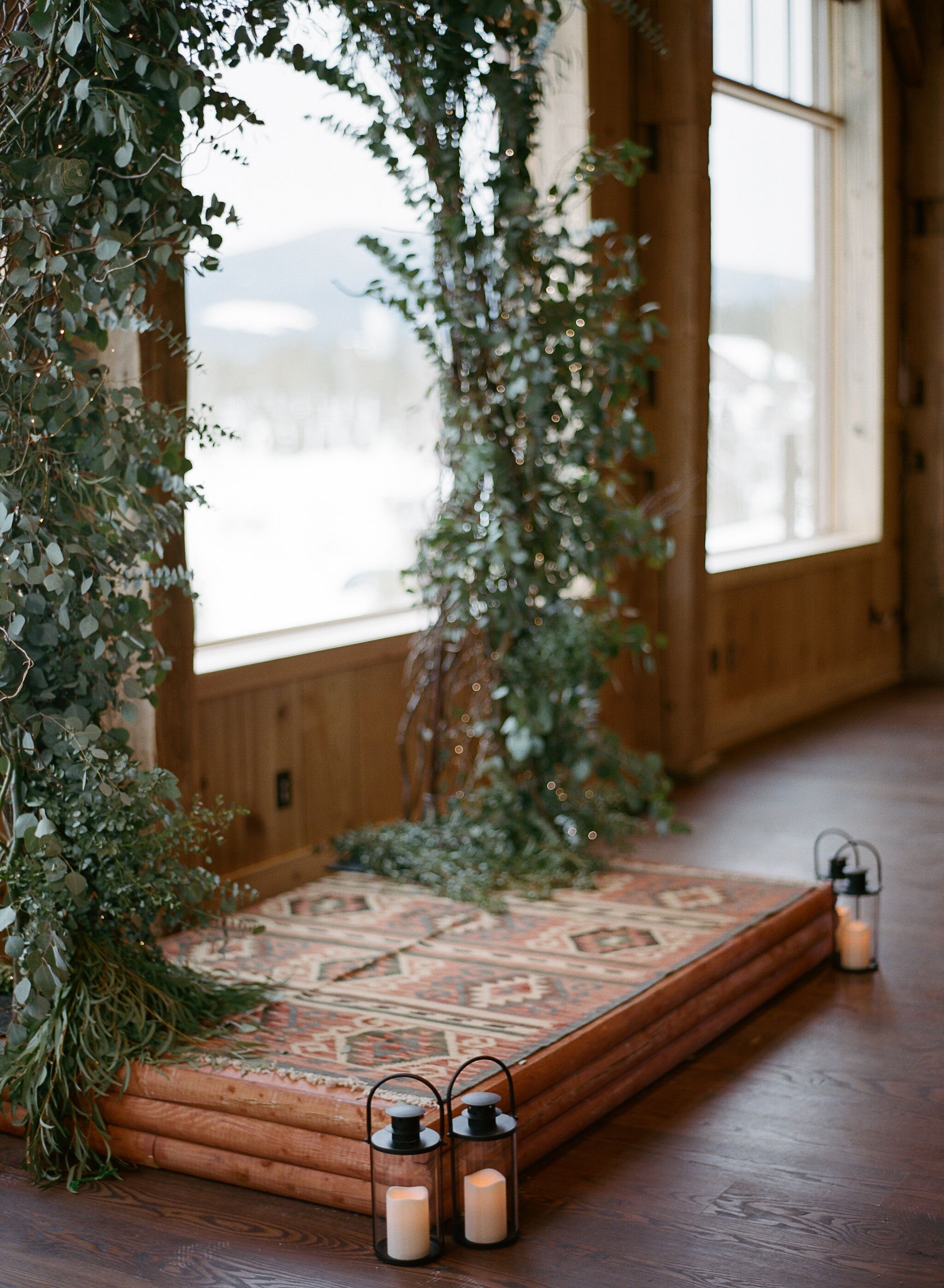 Rustic Log Ceremony Stage With Floral Arch