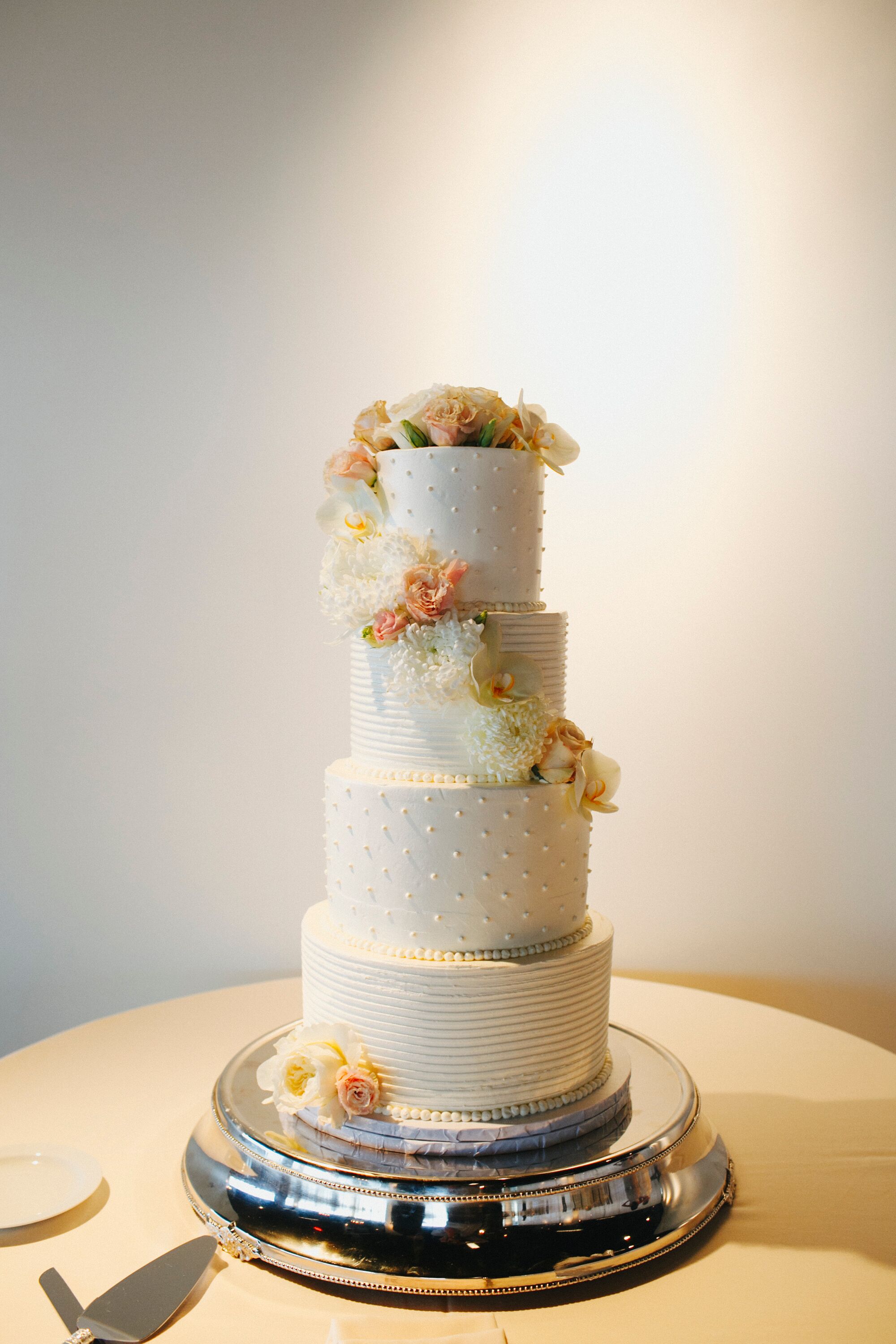 Tiered Wedding Cake on Silver Stand