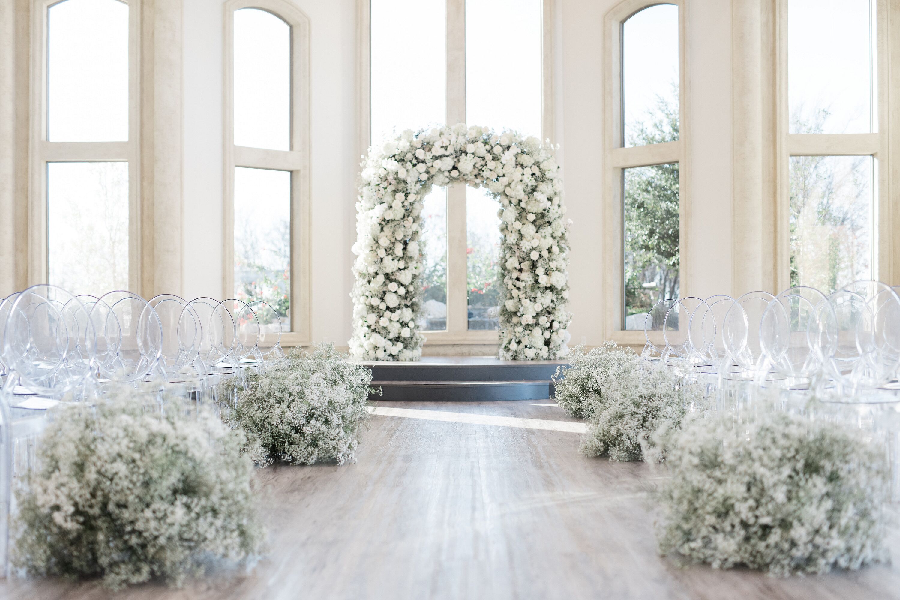 Lush Aisle Decor With Floral Wedding Arch