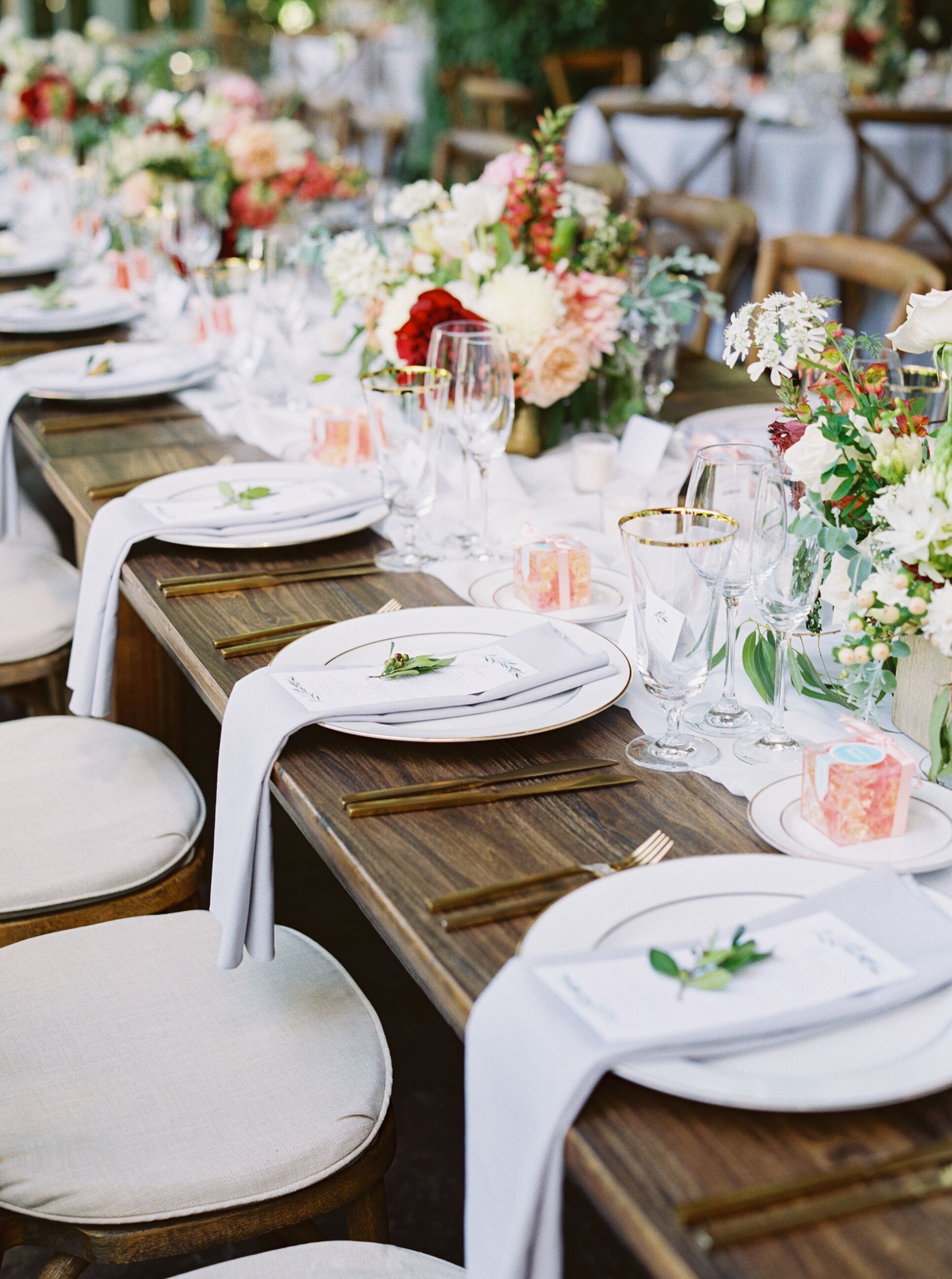 Rustic Farm Tables with Gold Flatware and Glassware