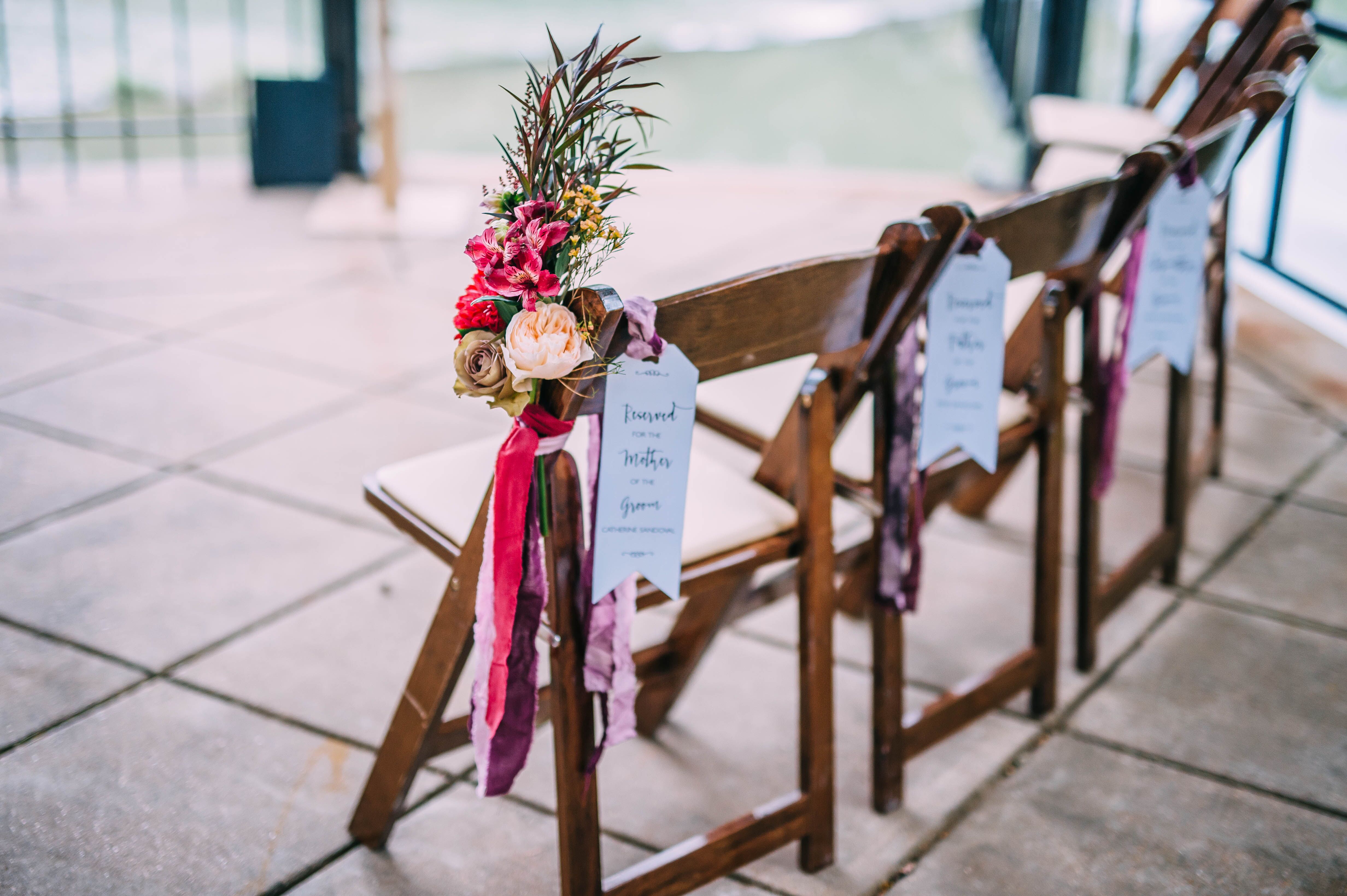 Wooden Ceremony Chairs with Colorful Florals and Dyed Ribbon