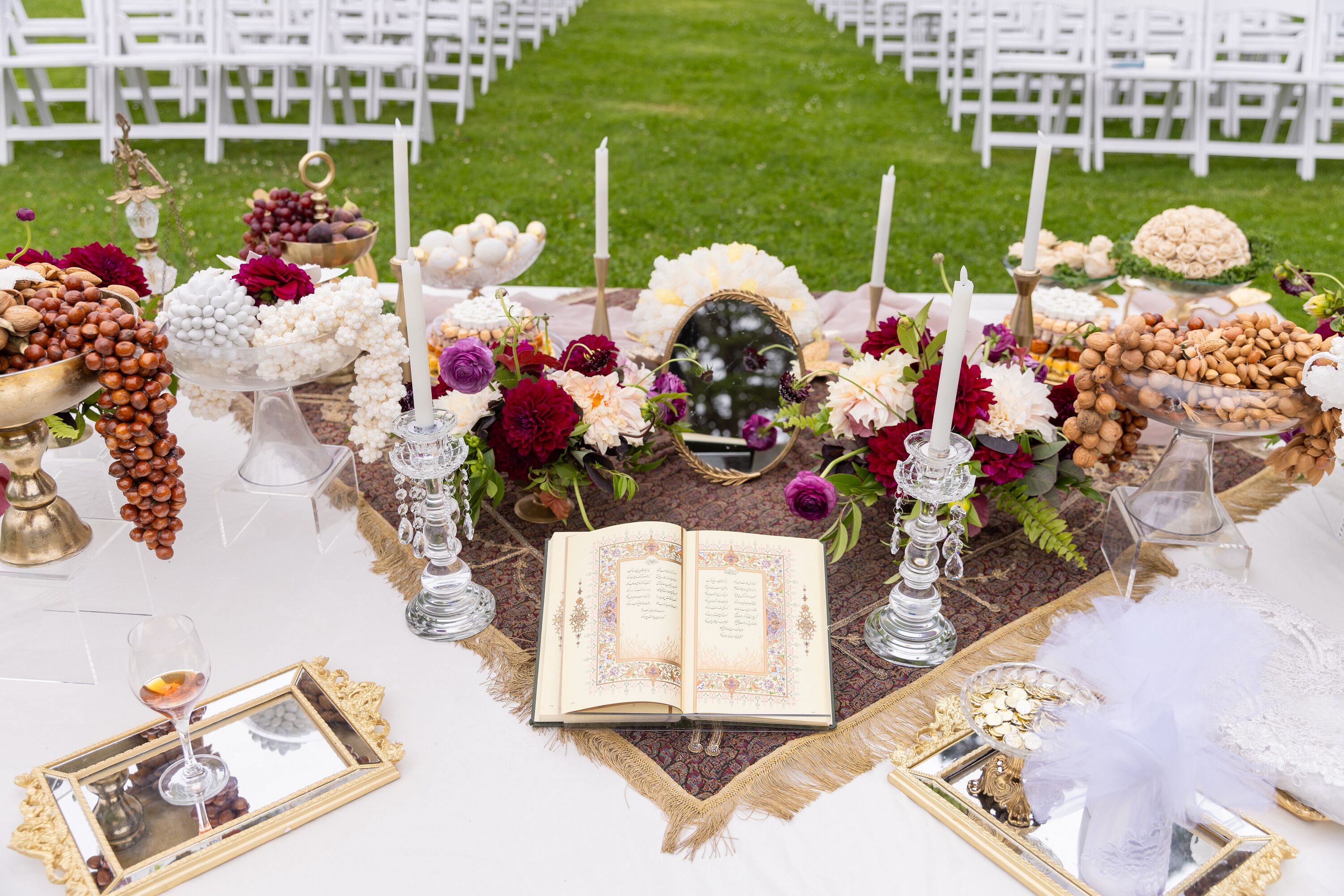 Traditional Sofreh Aghd Ceremony Set-Up With Food, Wine and Religious Text