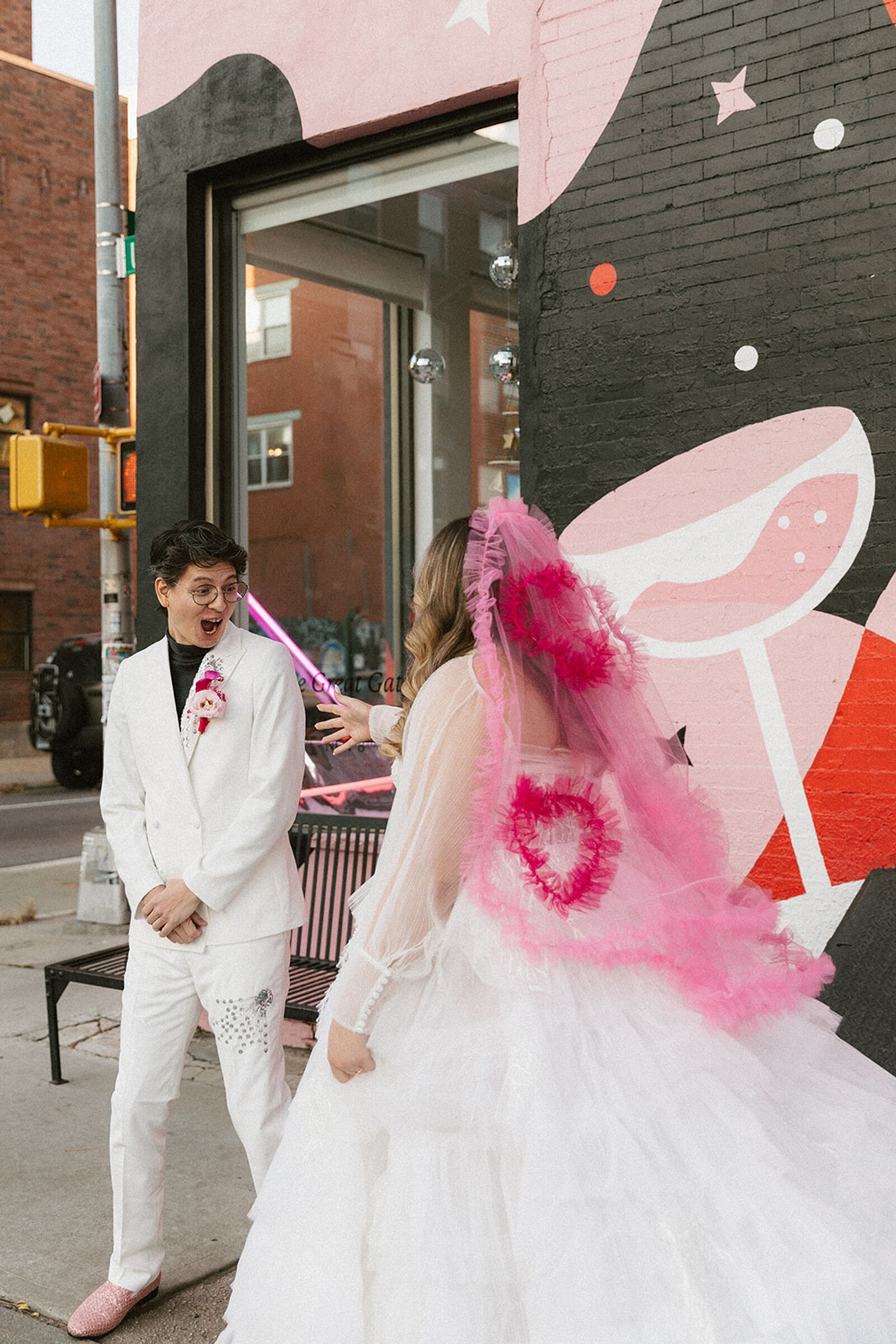 Groom in White Suite, Pink Boutonniere Overwhelmed By Bride in Ballgown ...