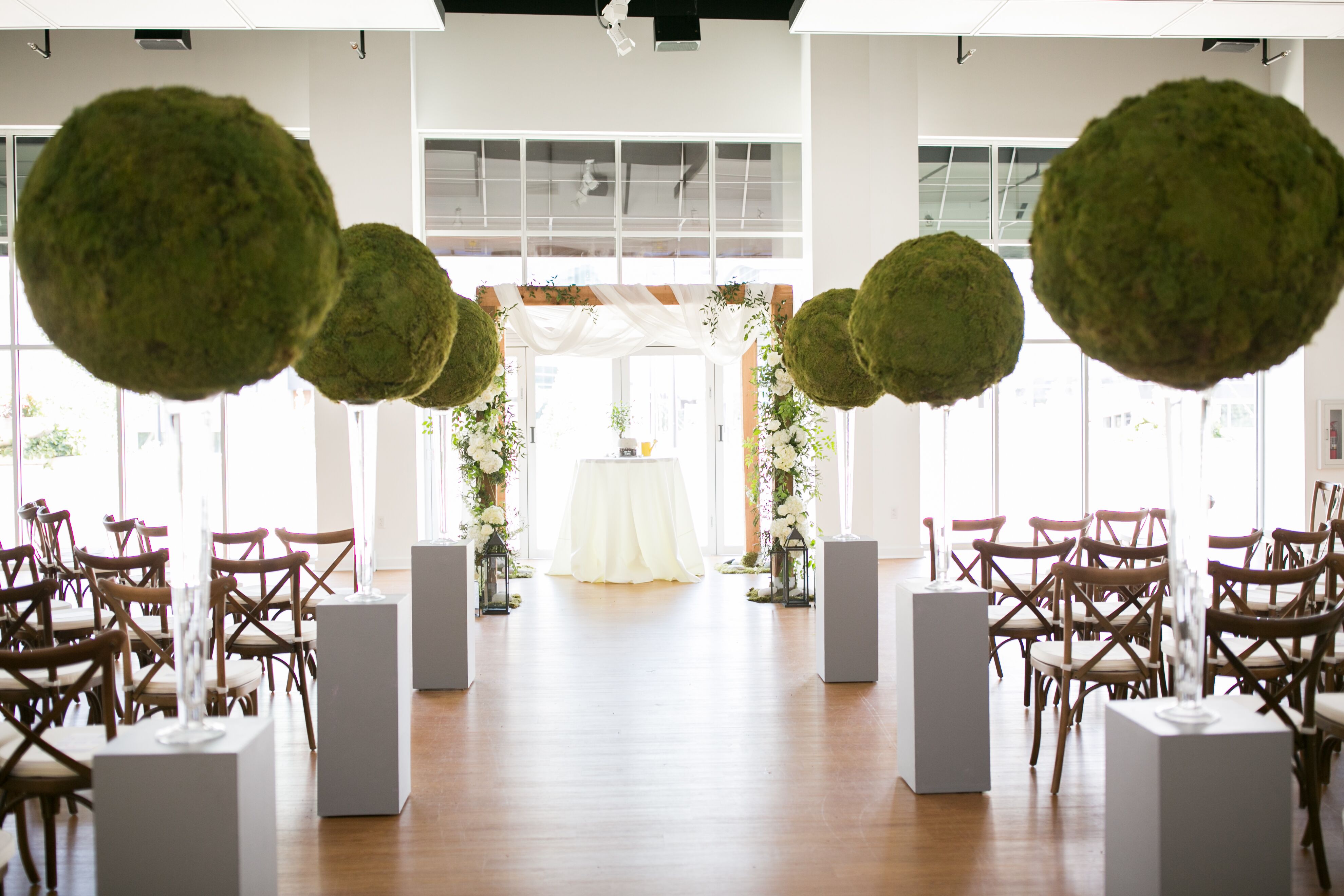 Large Moss Topiaries Lining Aisle