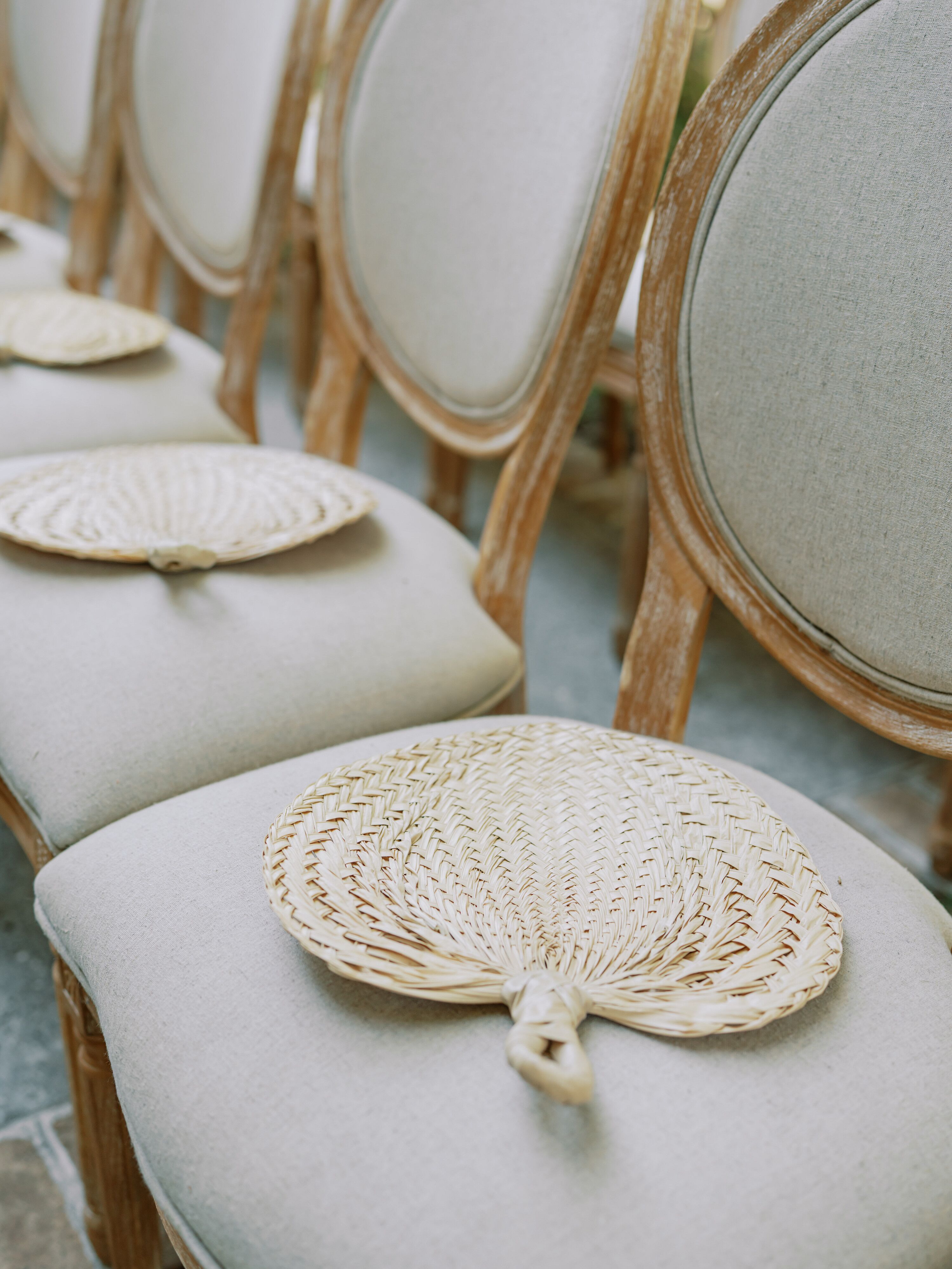 Wicker Fans on Fabric Ceremony Chairs With Wood Accents