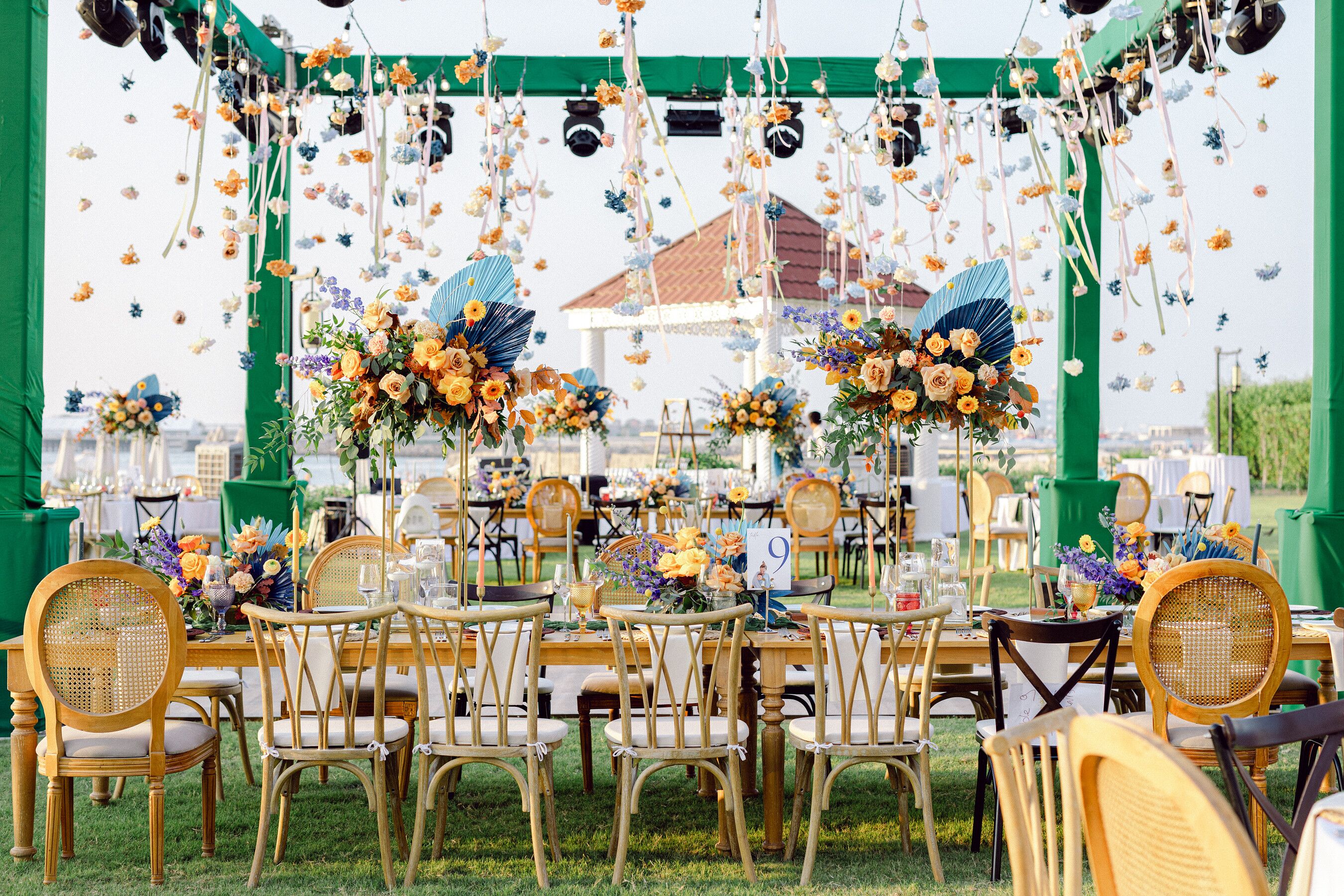 Whimsical Dining Table With Tall and Low Centerpieces, Hanging Strings ...