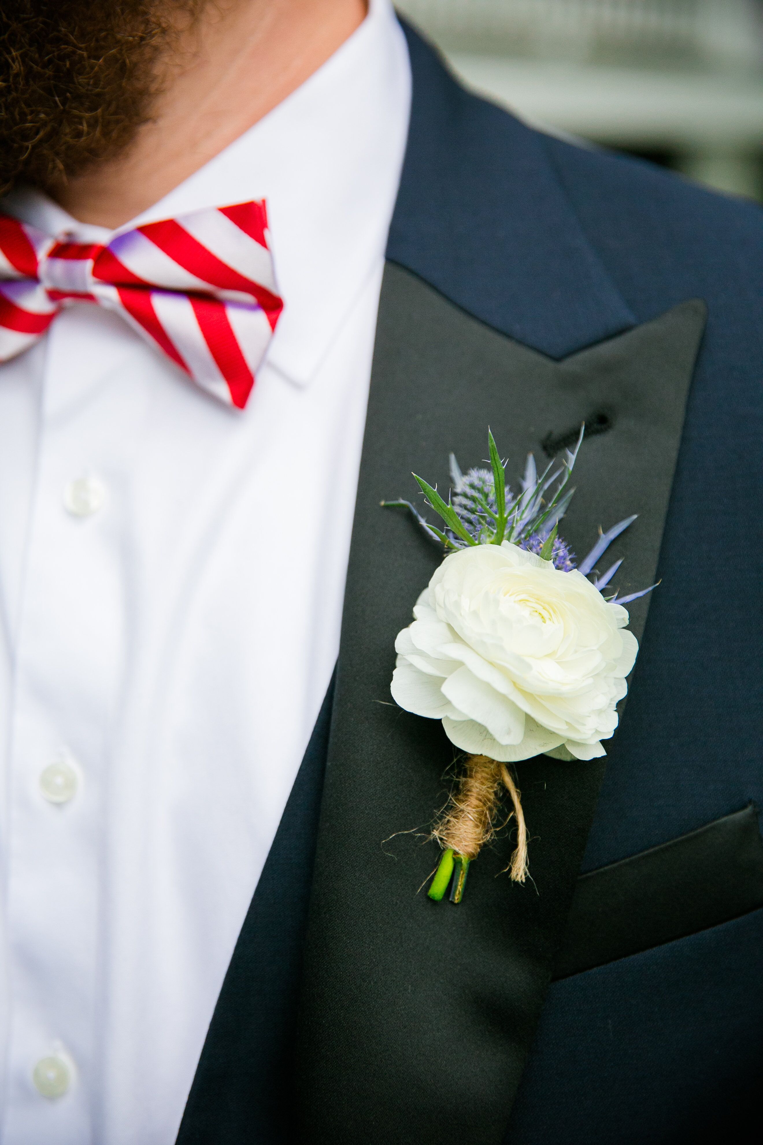 White Ranunculus, Blue Thistle Groomsmen Boutonniere