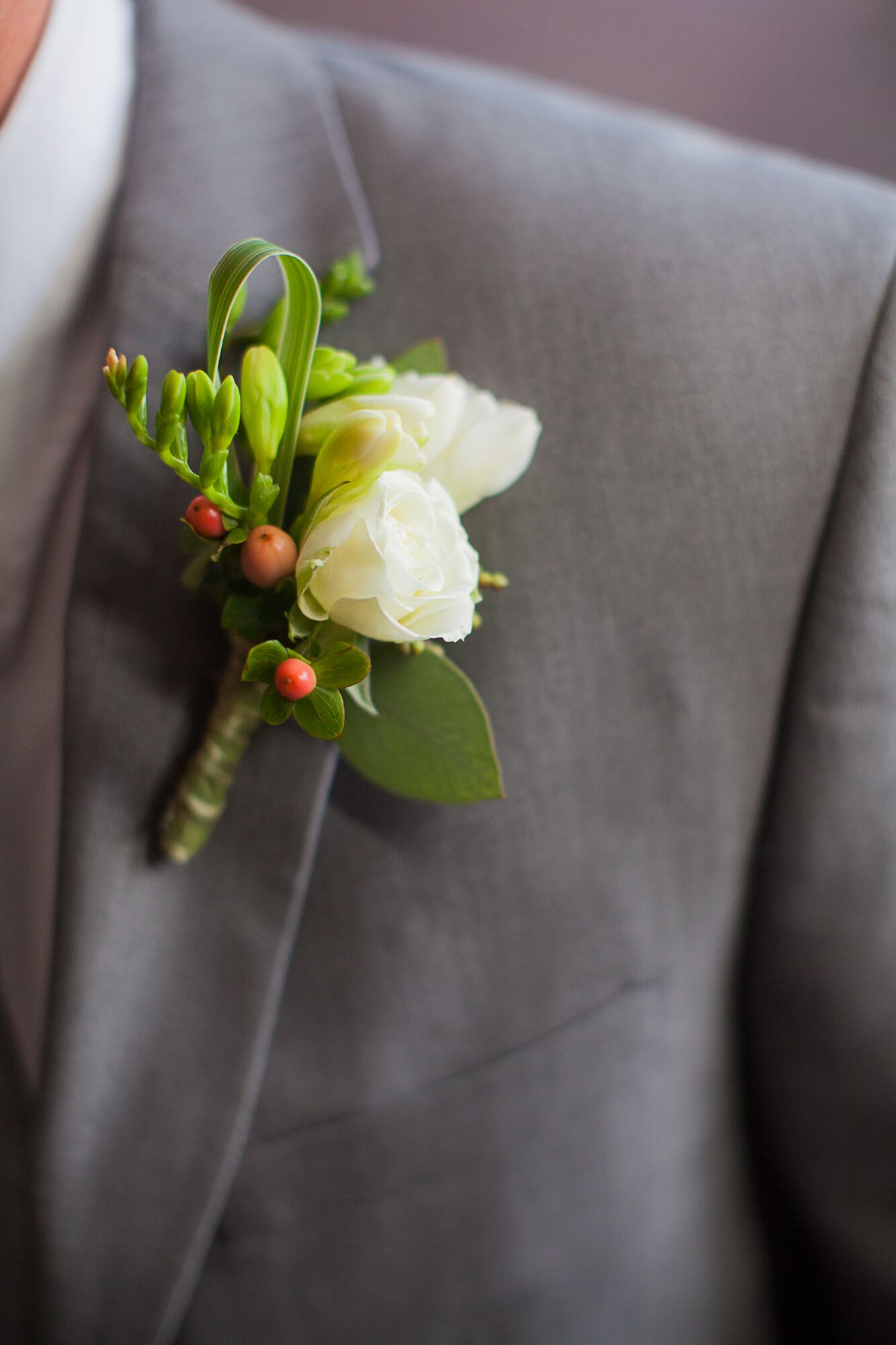 White Freesia Peach Hypericum Berry Boutonniere