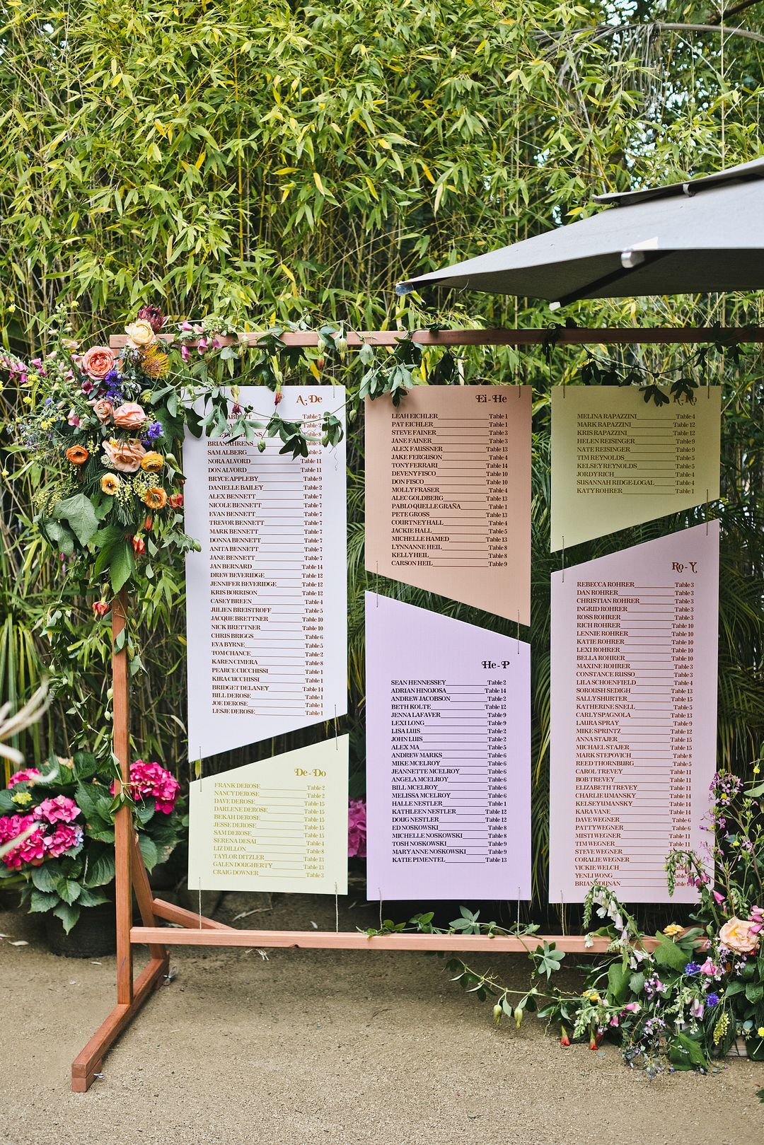 Geometric Pastel Seating Chart With Groovy Retro Vibes and Bright Flowers