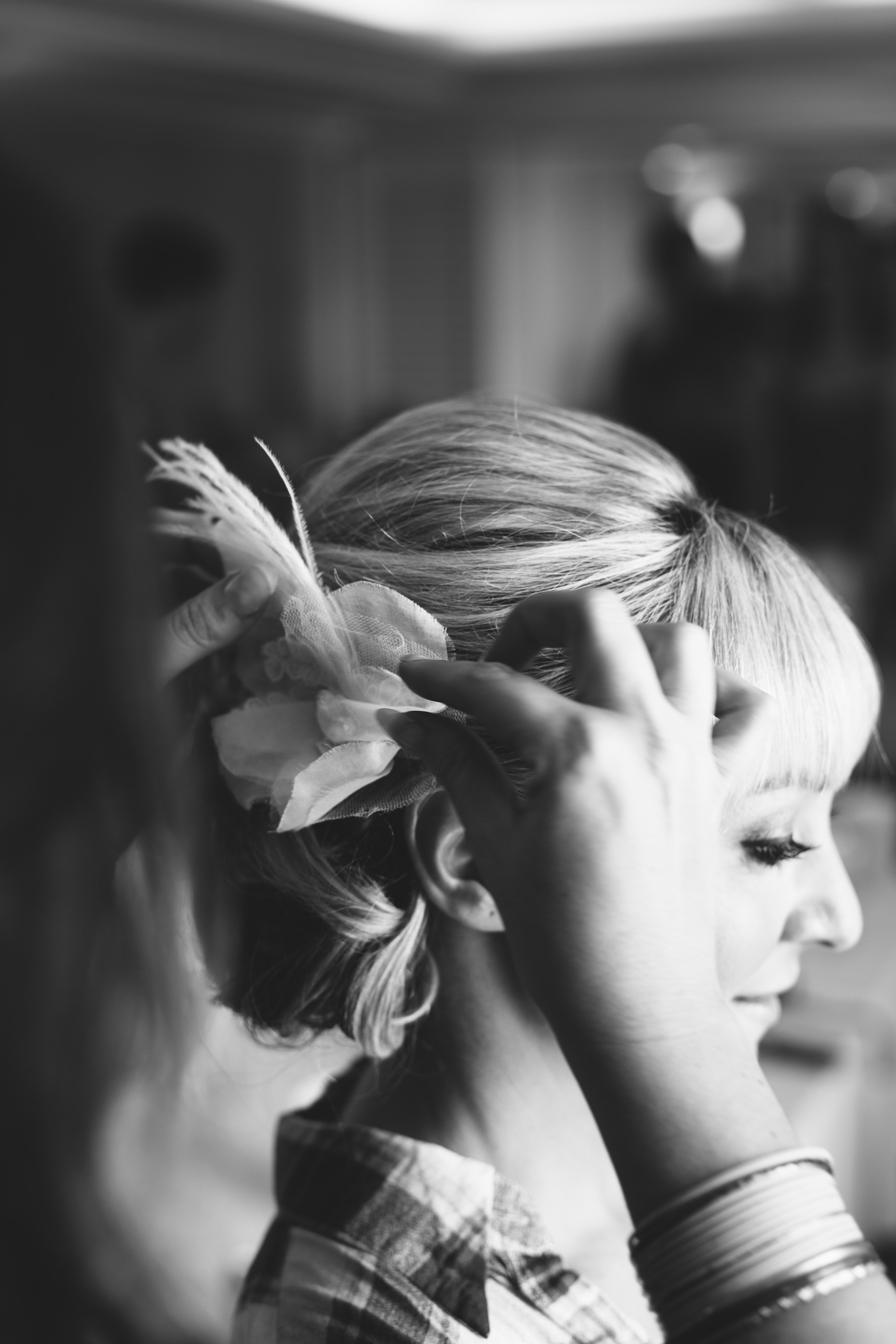 Bride Getting Hair Ready with Feather and Flower