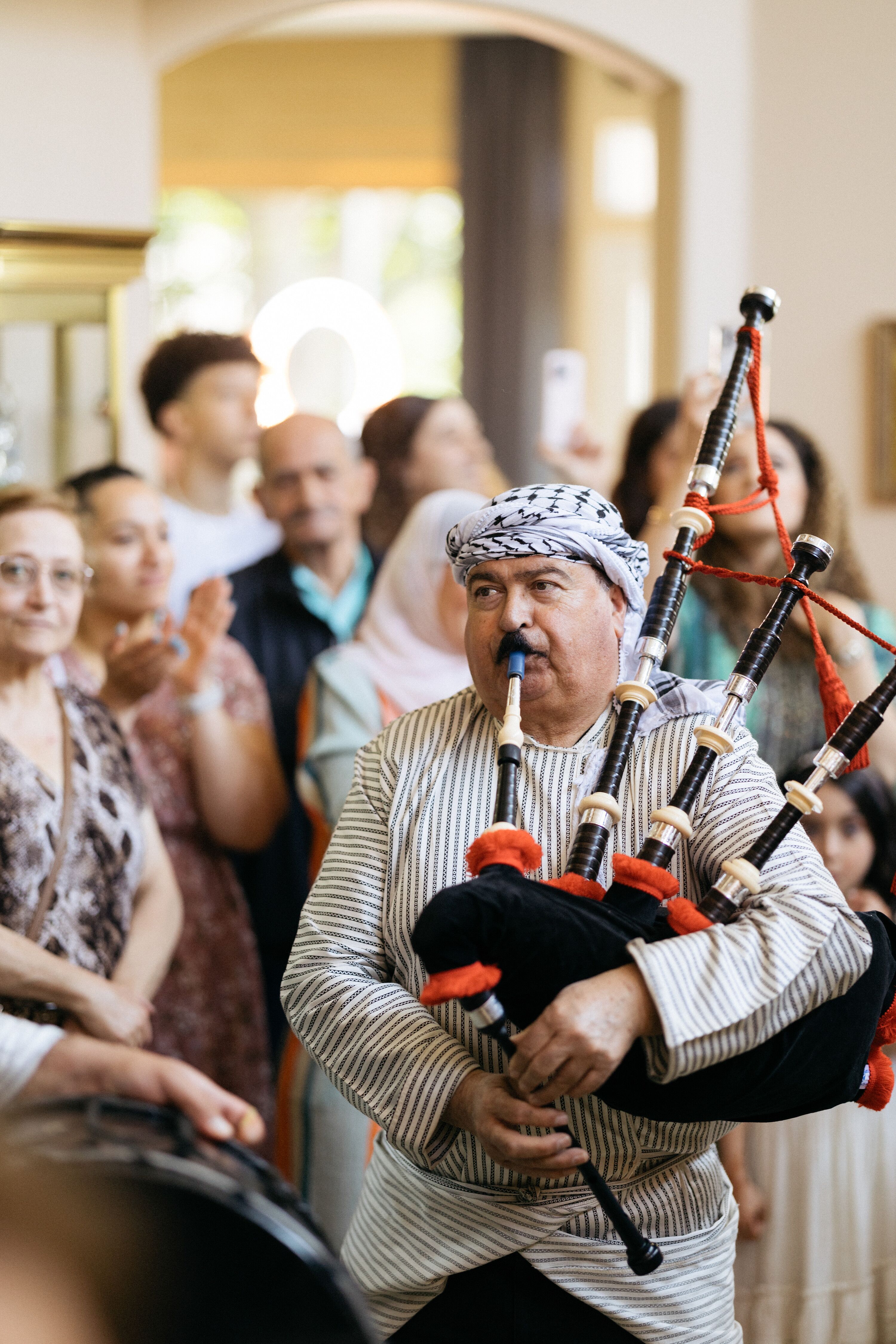 A Traditional Zaffa Wedding Procession With a Bagpipe Musician