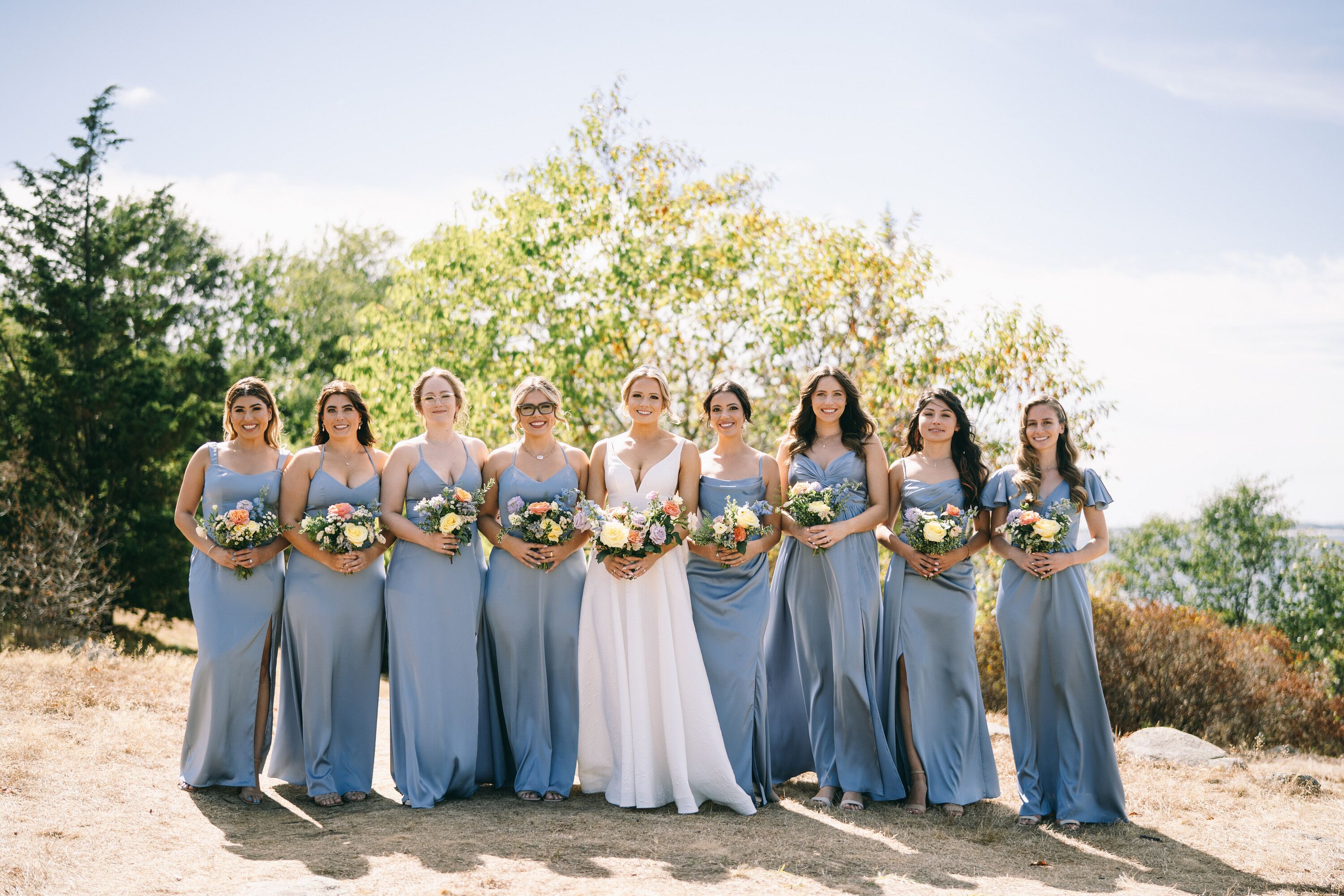 Bridesmaids in Long Blue Bridesmaid Dresses at Nautical Wedding