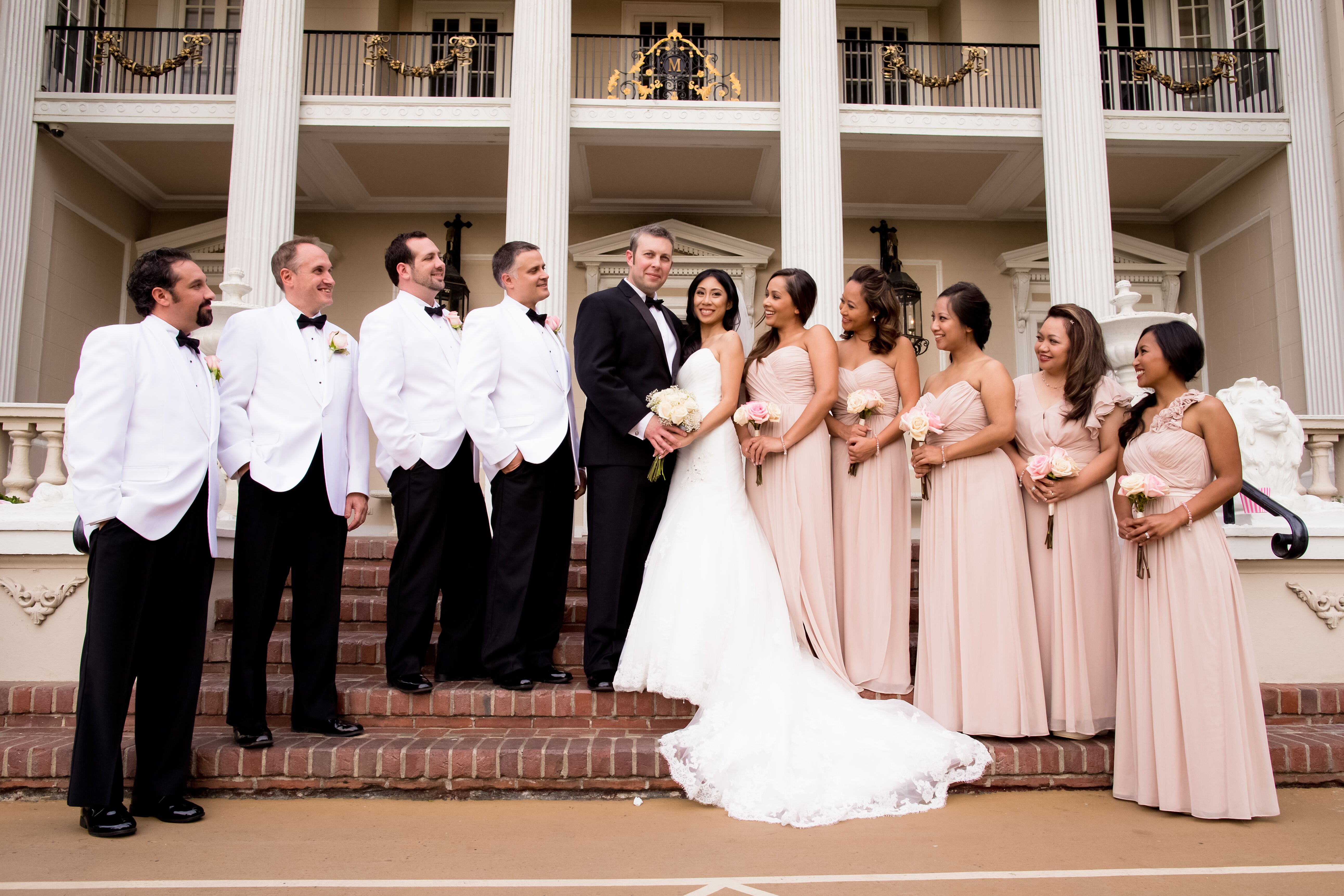 Bride and Groom Pose with Groomsmen and Bridal Party