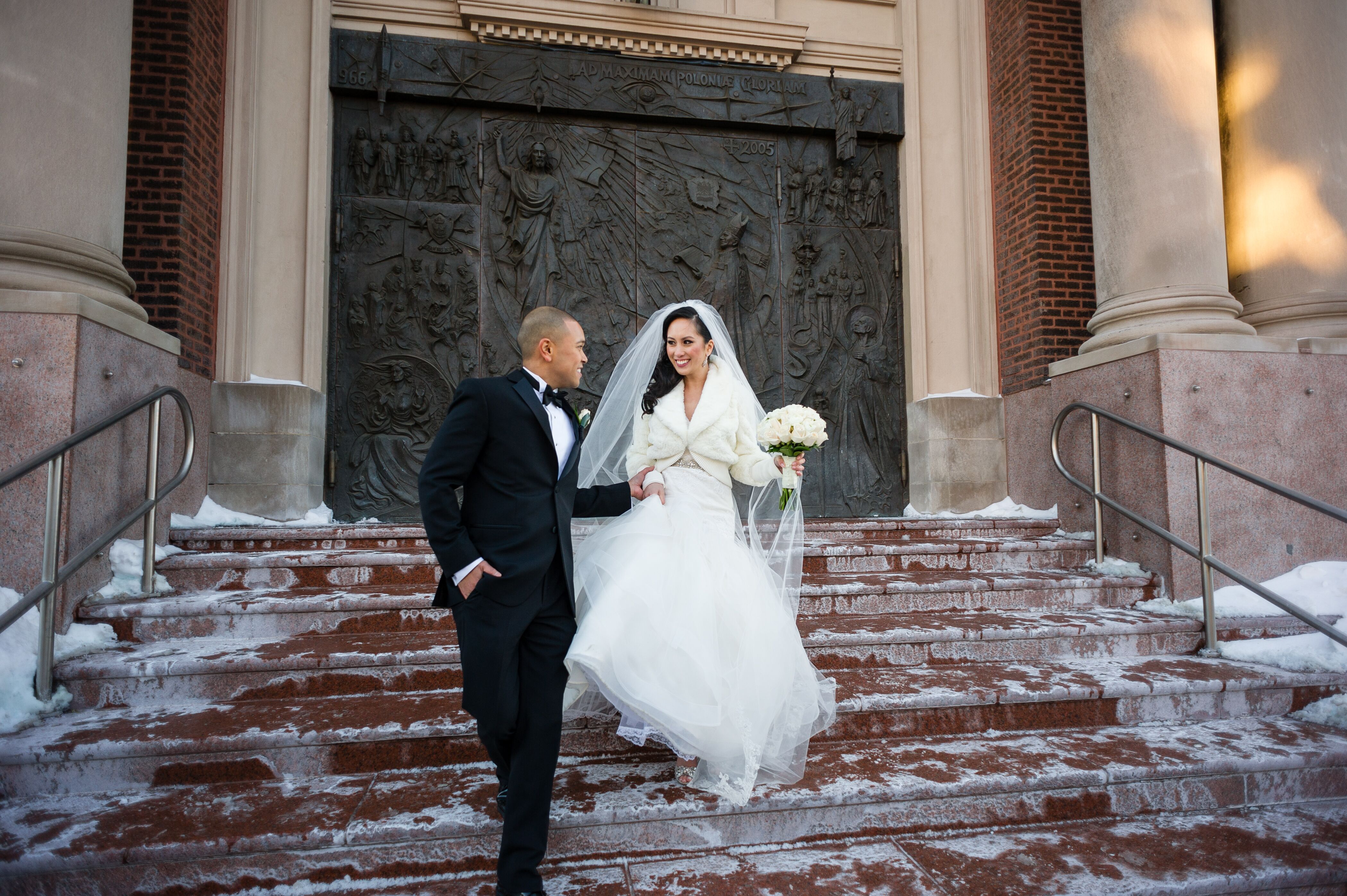 Bride and Groom Posing on Church Steps