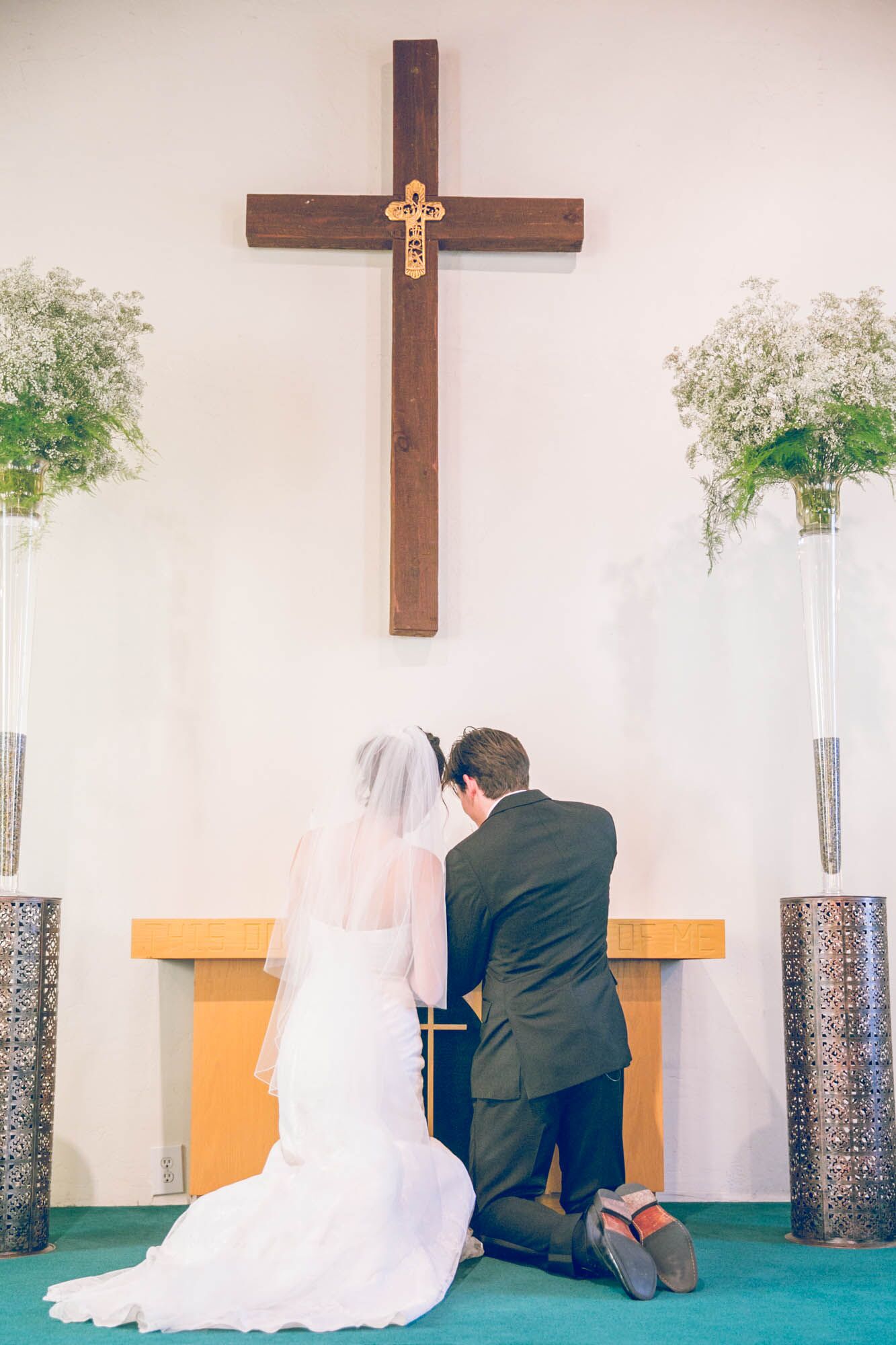Bride and Groom Kneeling at Ceremony
